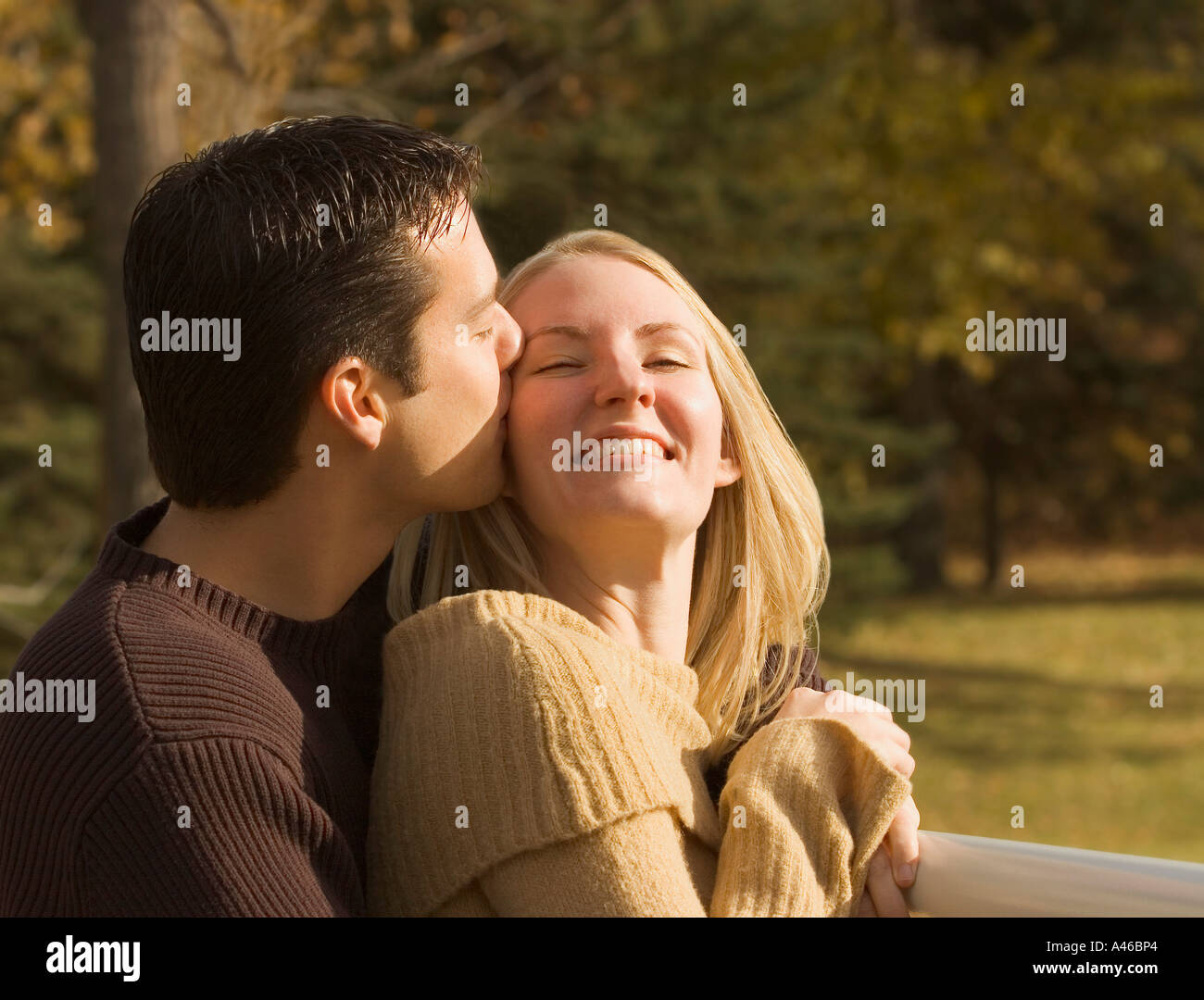 Man kisses woman s face Stock Photo - Alamy