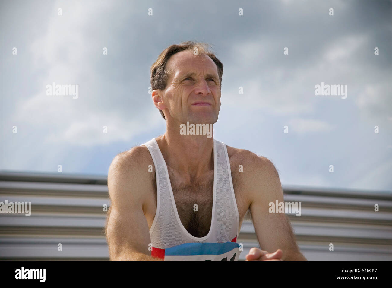Athlete watches from the bleachers Stock Photo - Alamy