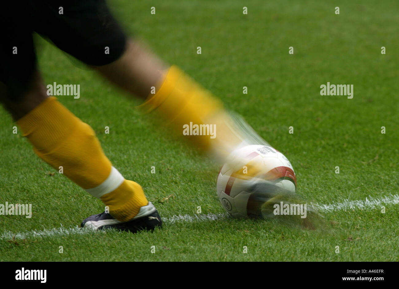 Legs of a football player during a football game Stock Photo - Alamy