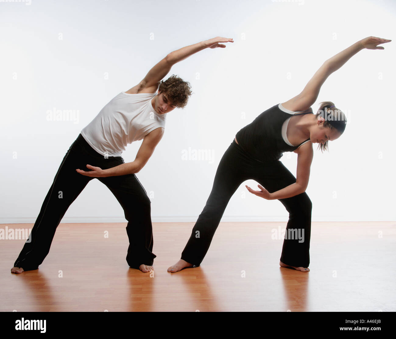 Couple stretching together Stock Photo - Alamy