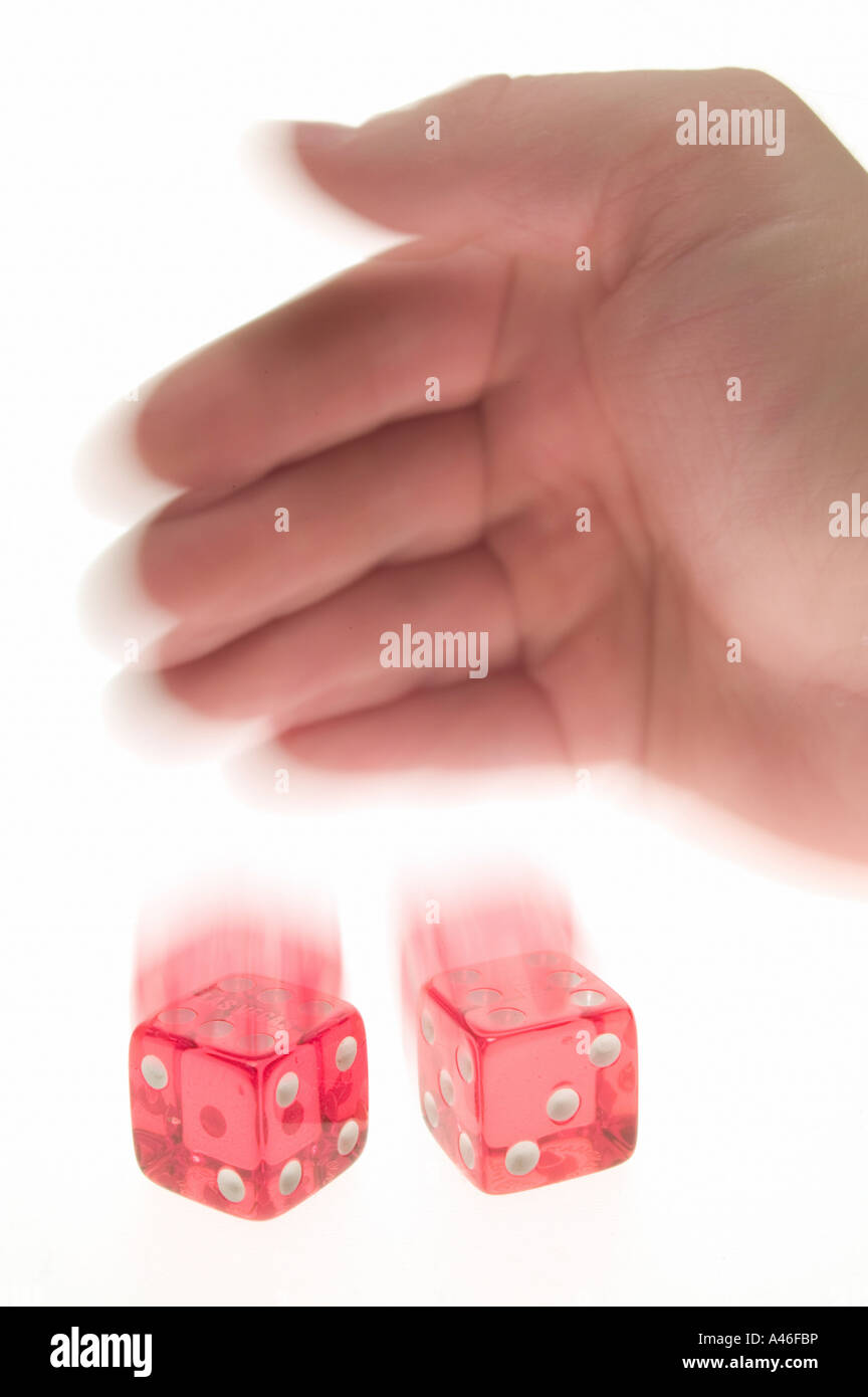Hand throwing two red dice on white background Stock Photo - Alamy
