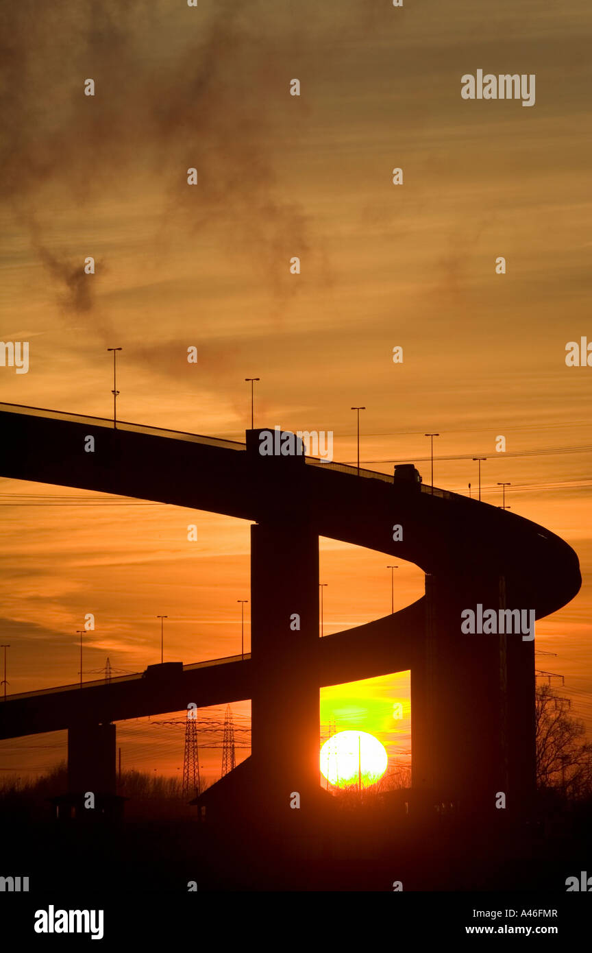 A curved bridge at sunset Stock Photo - Alamy