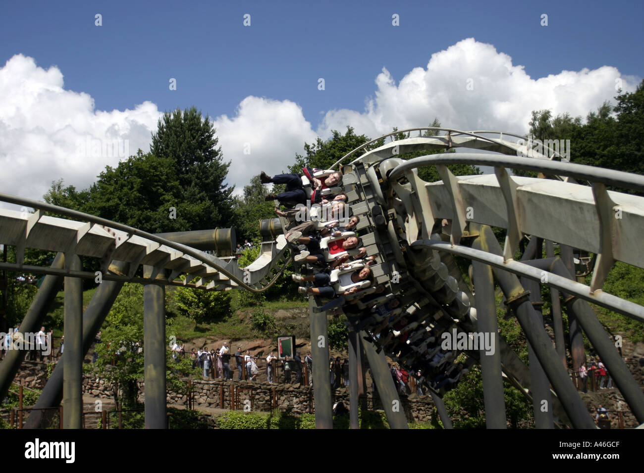 Visitors ride the Nemesis attraction at Alton Towers Stock Photo - Alamy