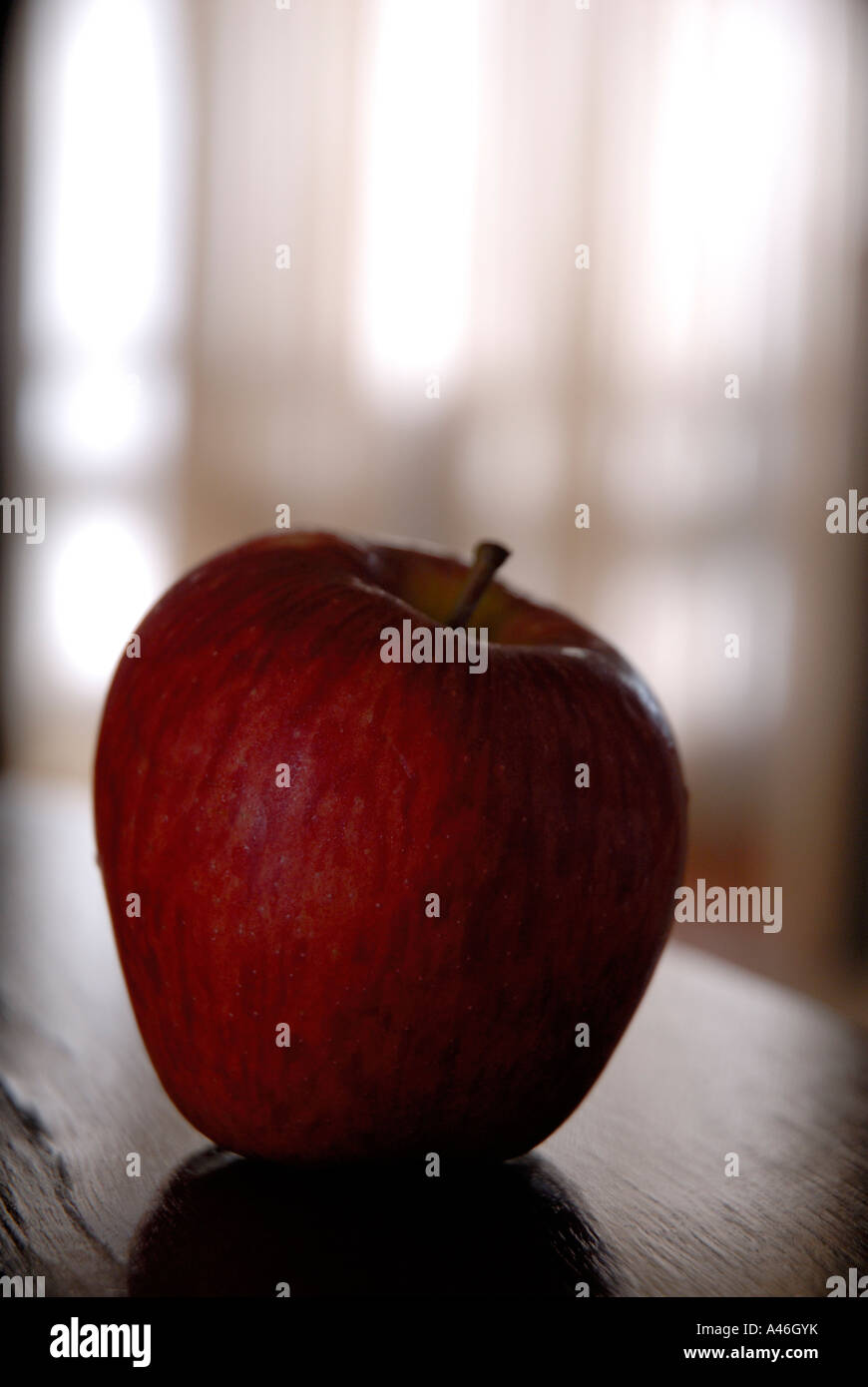 Apple on Table Stock Photo - Alamy