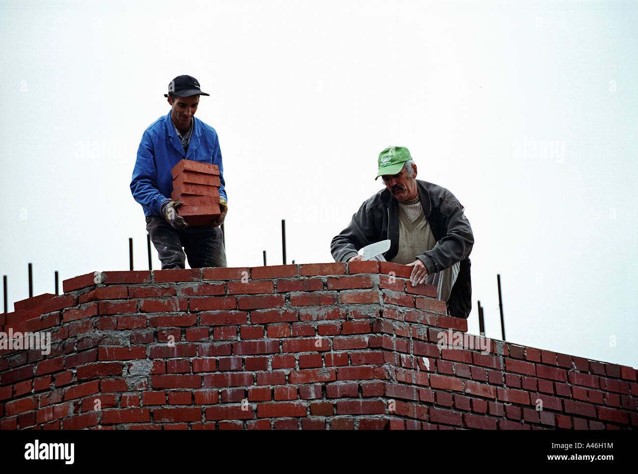 Bricklayers at work, Romania Stock Photo - Alamy