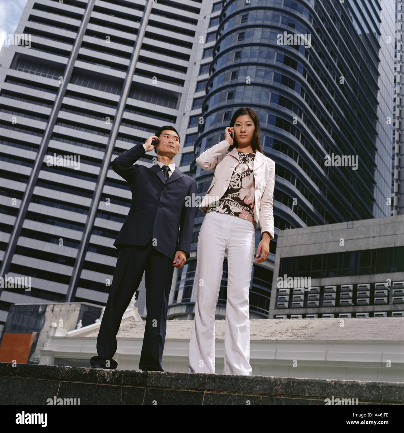 Businesspeople using cellular telephones Stock Photo - Alamy