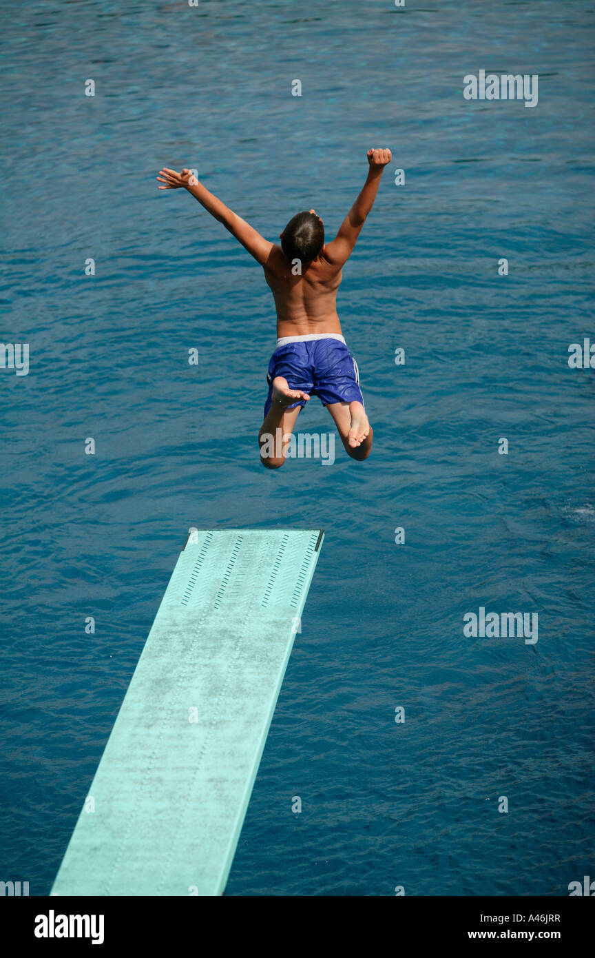 A boy jumping into the water Stock Photo - Alamy