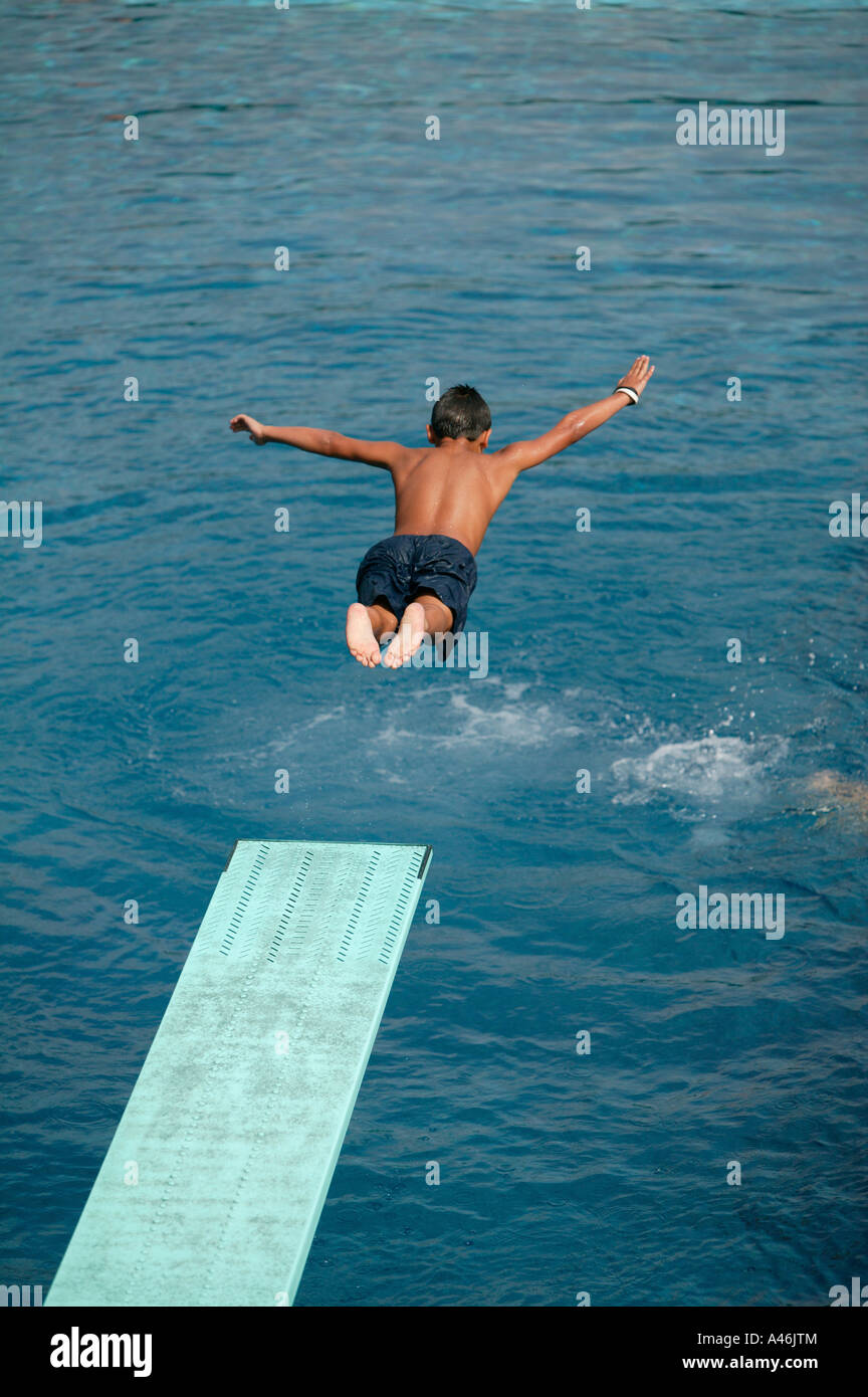 A boy jumping into the water Stock Photo - Alamy