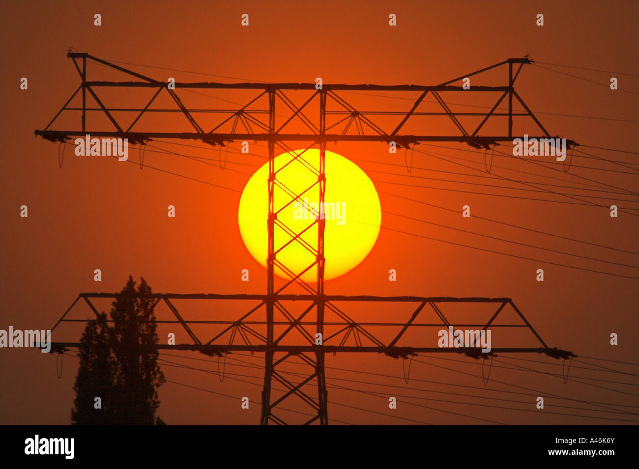 High voltage pylon at sunset Stock Photo - Alamy