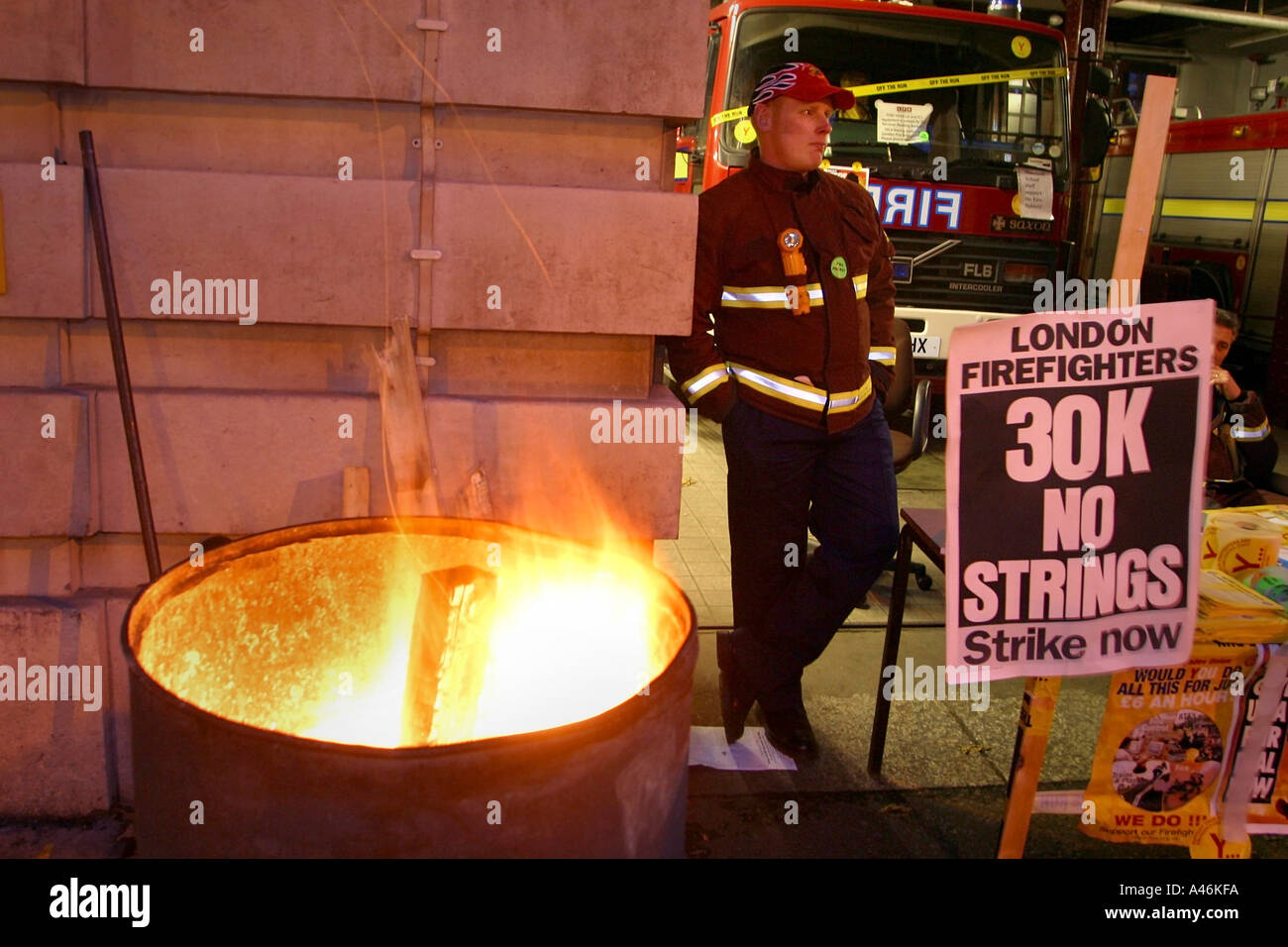 britsh firefighters strike a striking firefighter stands behind a ...