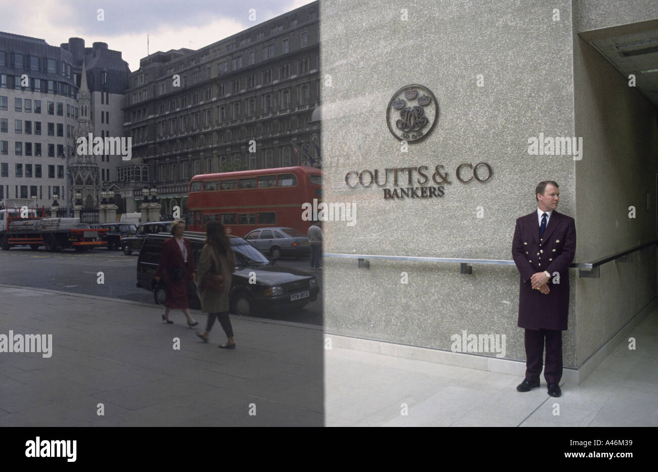 A doorman stands at the entrance to Coutts Bank on the Strand in London ...