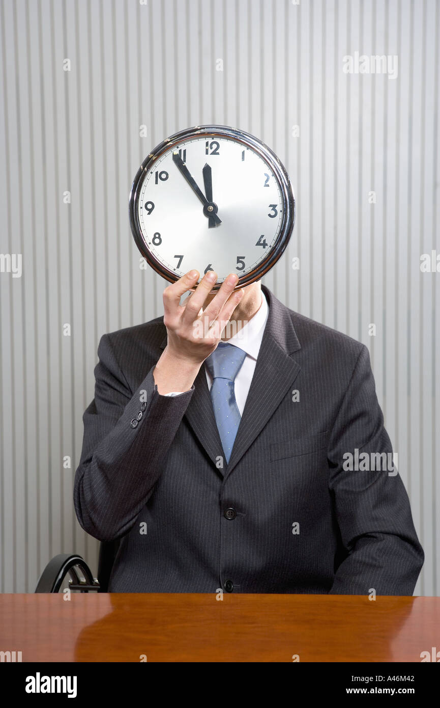 Businessman sitting on clock hi-res stock photography and images - Alamy