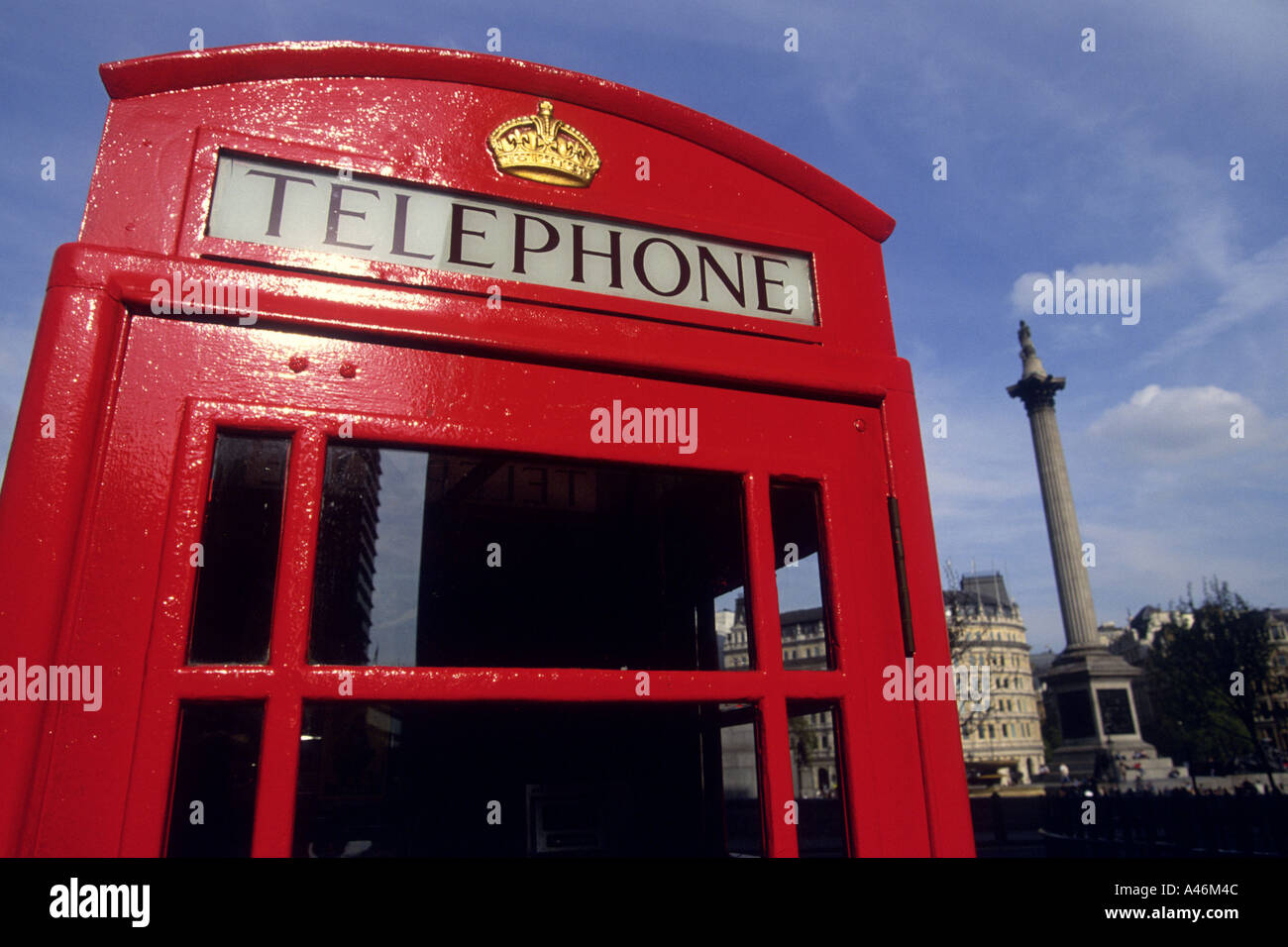 A group of traditional red telephone boxes stand on the Bayswater Road ...