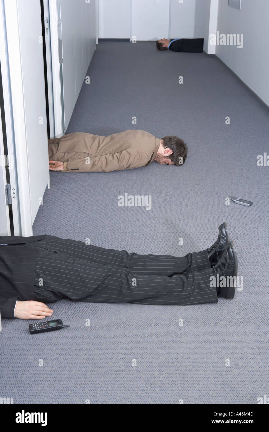Three dead businessmen Stock Photo - Alamy