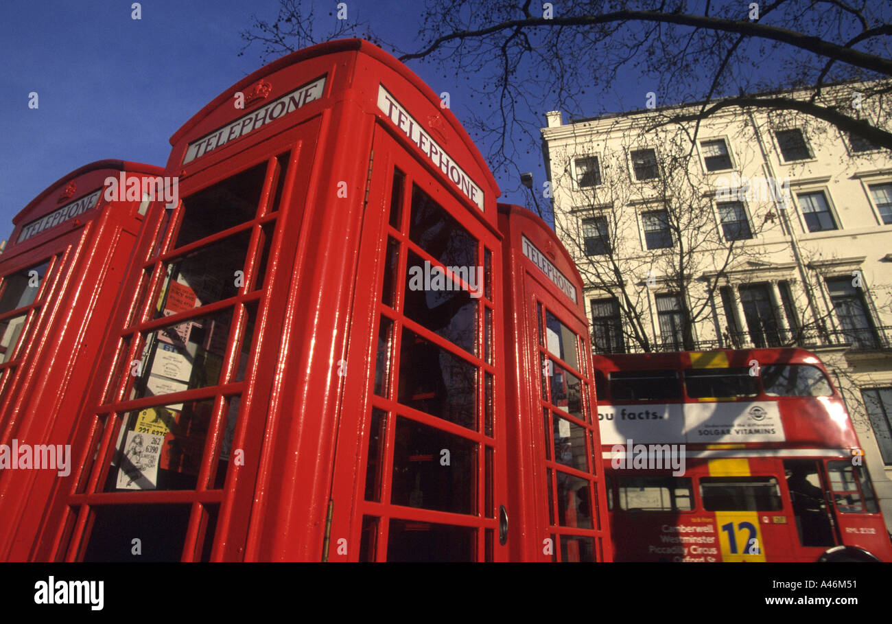 A group of traditional red telephone boxes stand on the Bayswater Road ...