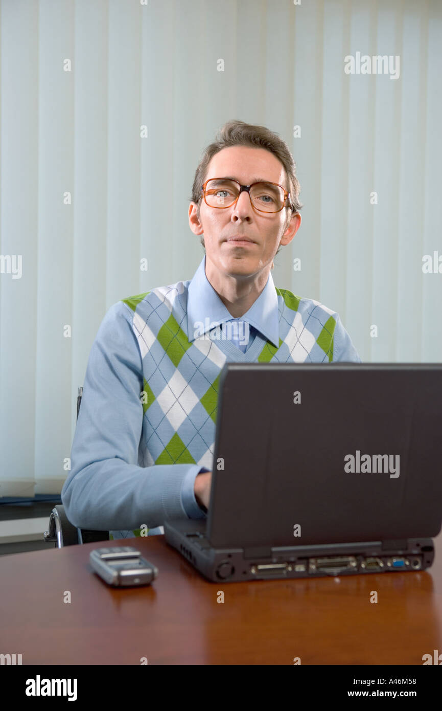 Office worker using laptop computer Stock Photo - Alamy