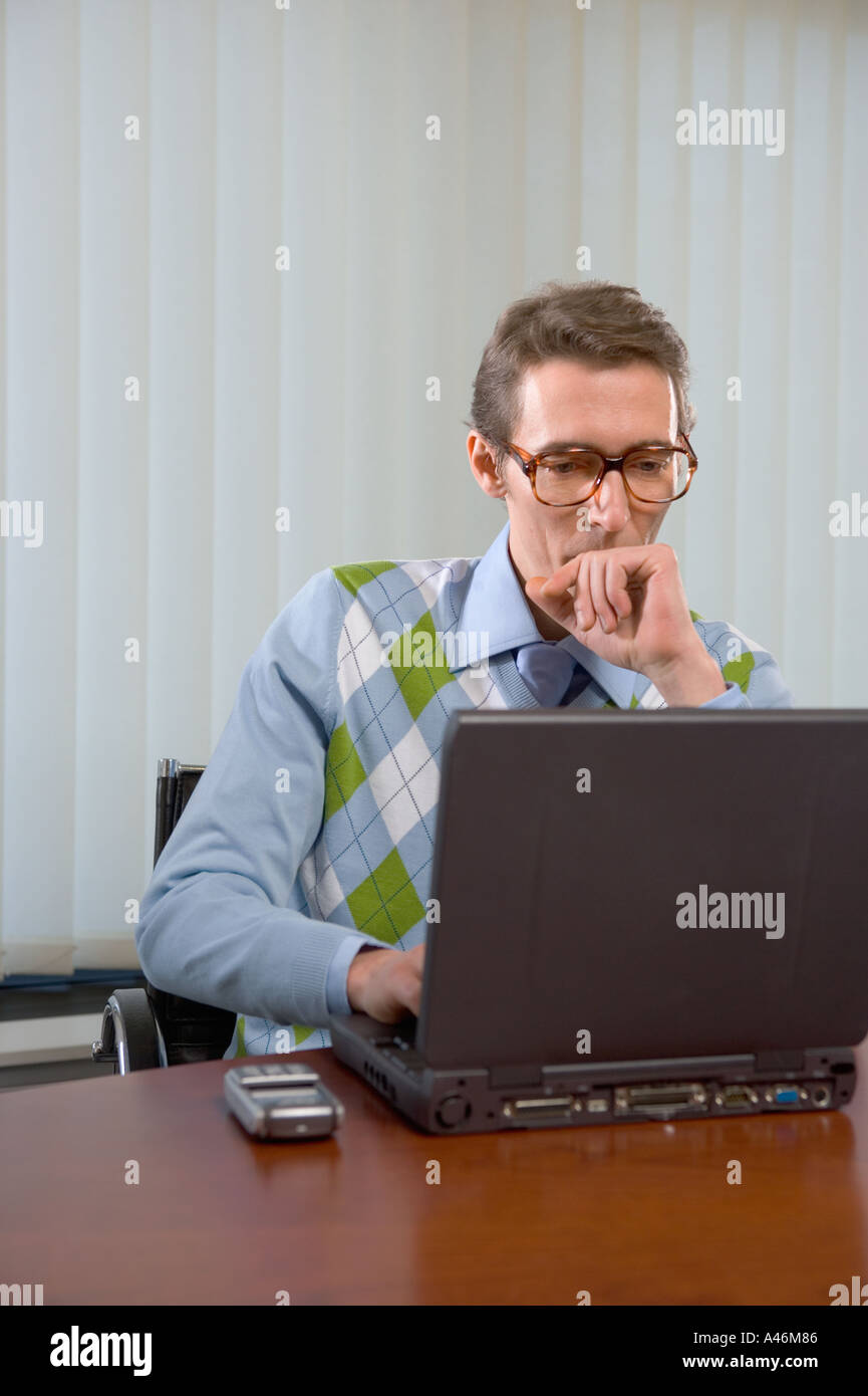 Office worker using laptop computer Stock Photo - Alamy