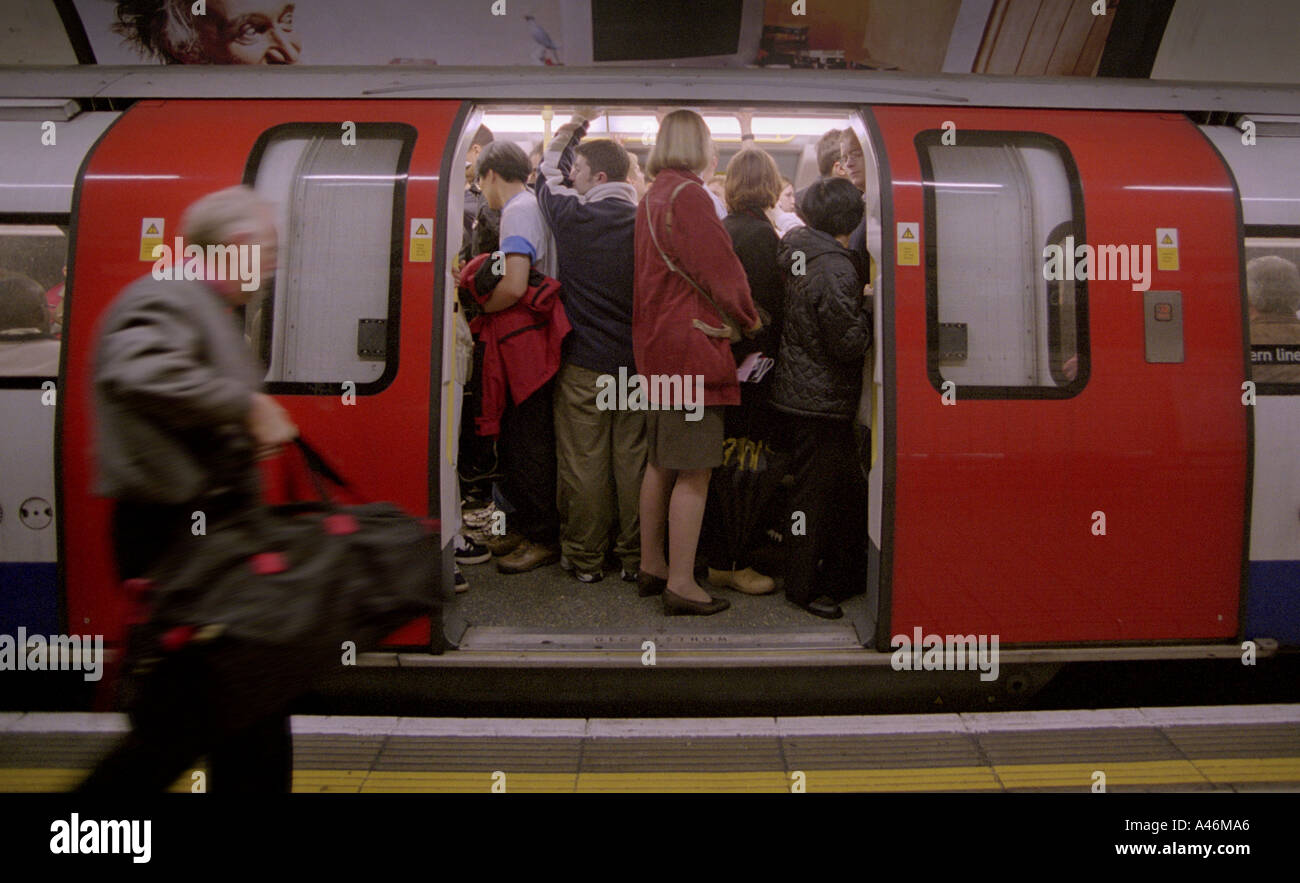 Commuters crowd onto a tube train at Tottenham court Road Underground ...