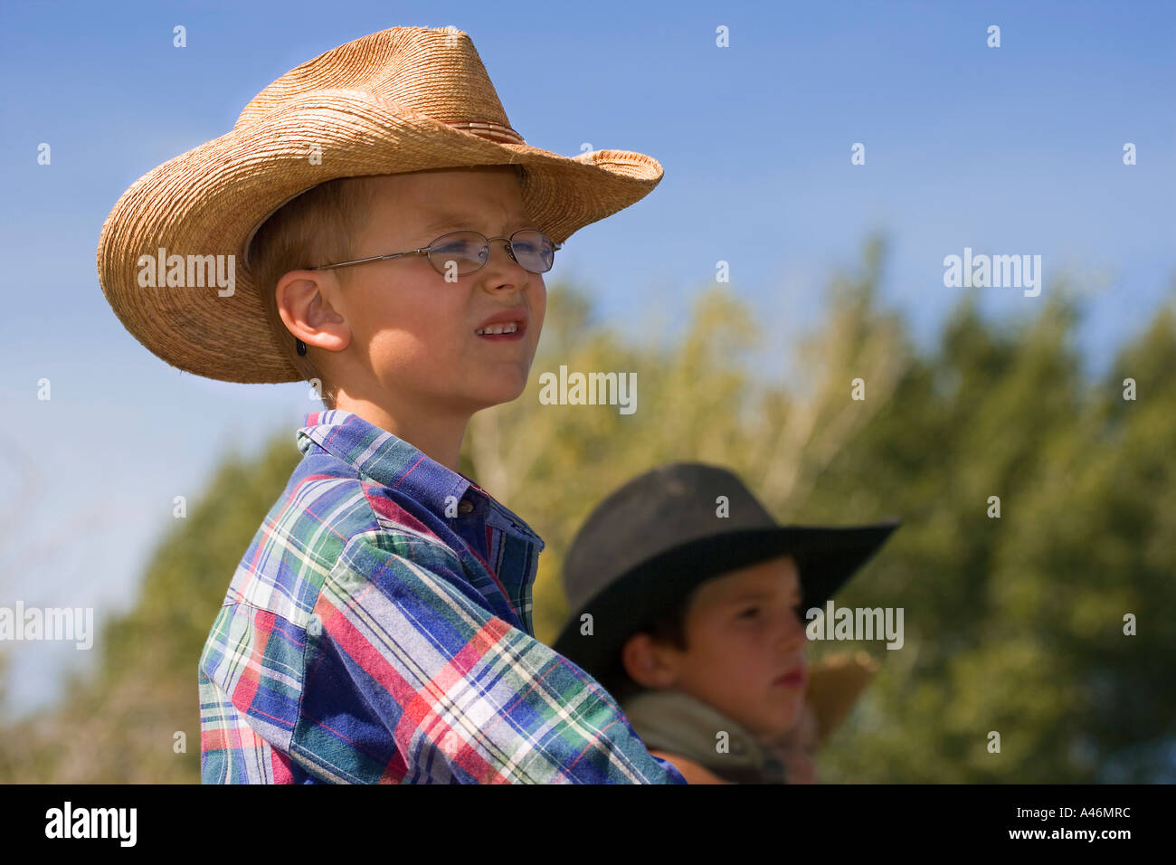 Boys wearing cowboy hats Stock Photo - Alamy