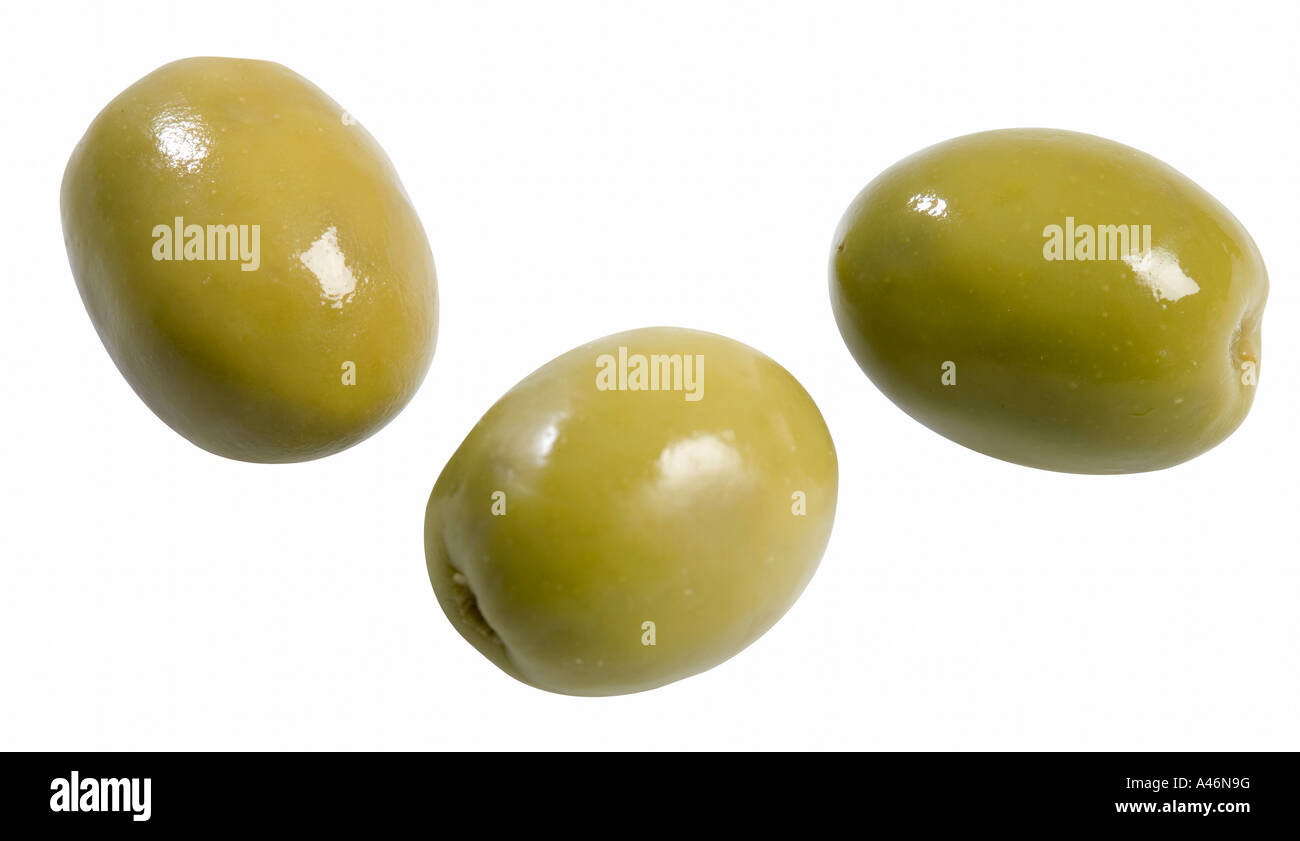 Three green olives on white background Stock Photo - Alamy