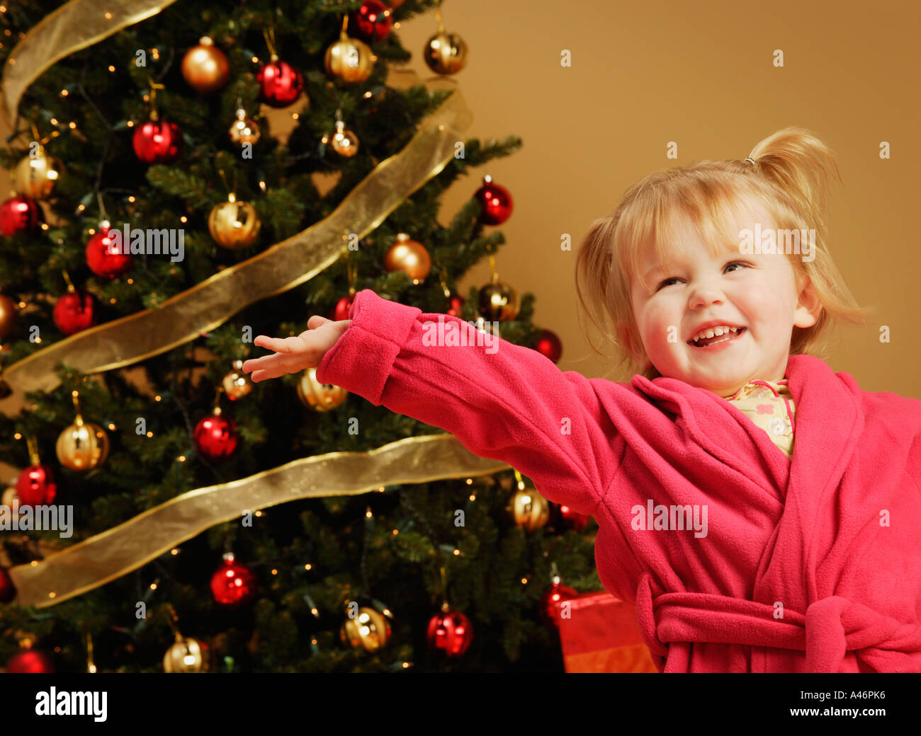 Child facing christmas tree hi-res stock photography and images - Alamy