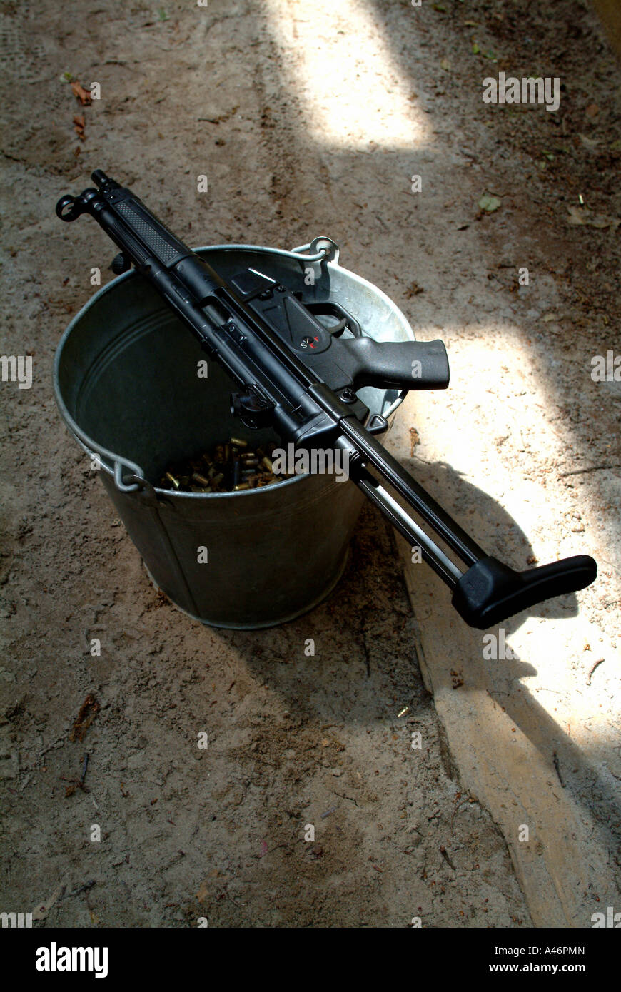 Rifle on a bucket full of ammunition Stock Photo - Alamy