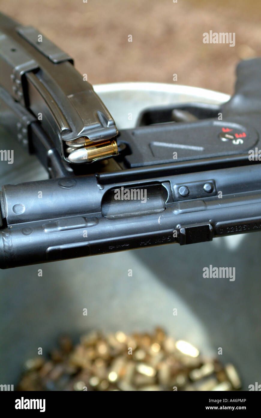 Loaded rifle on a bucket full of ammunition Stock Photo - Alamy