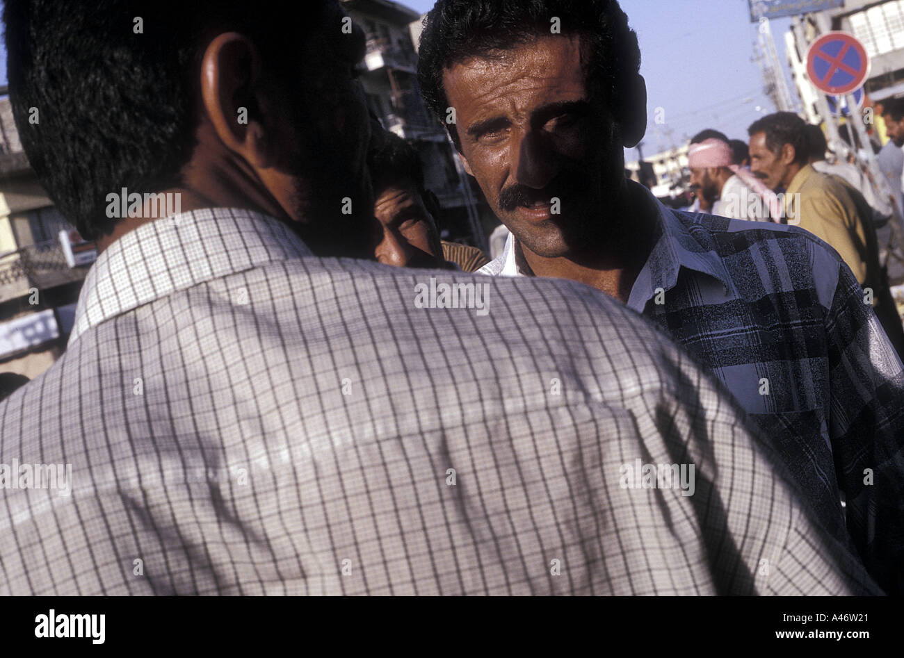 two men meet on the street baghdad iraq Stock Photo - Alamy
