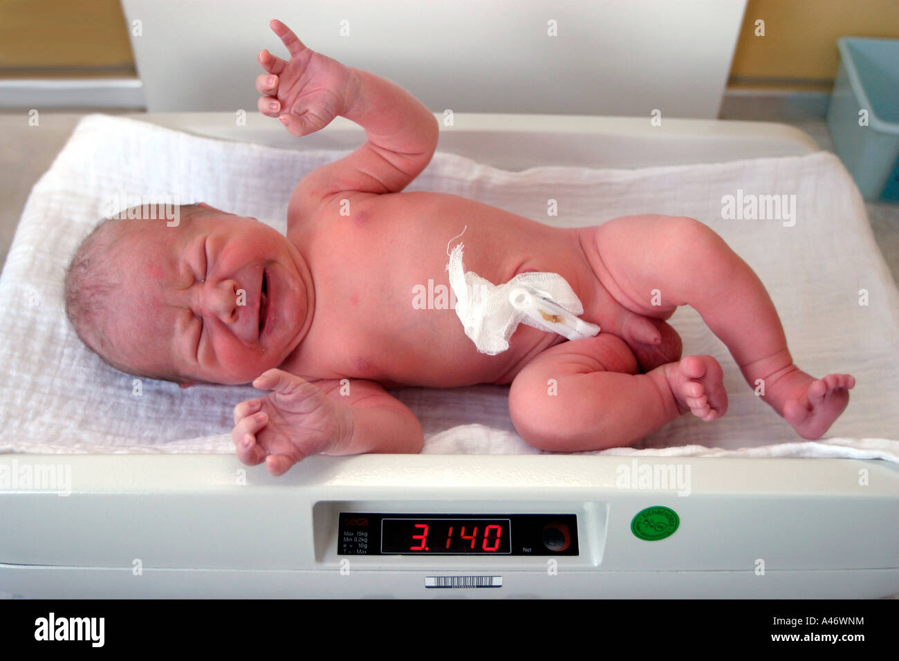 Baby boy on weight scale hi-res stock photography and images - Alamy
