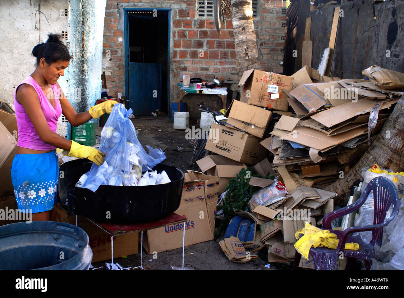 Poor woman is separating rubbish waste, Favela Imbiribeira, Recife ...