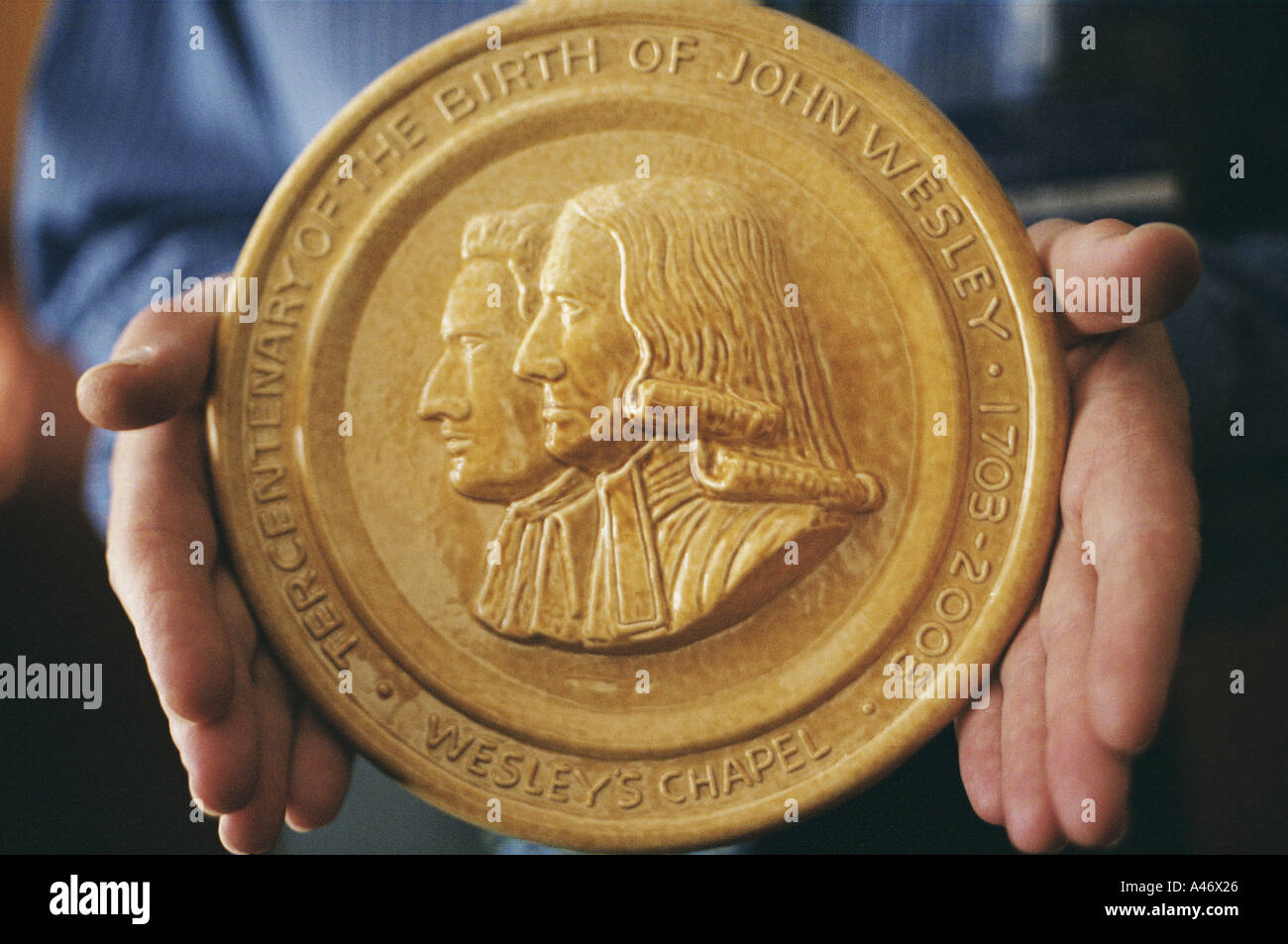 A comemorative plate showing an image of John Wesley the founder of ...