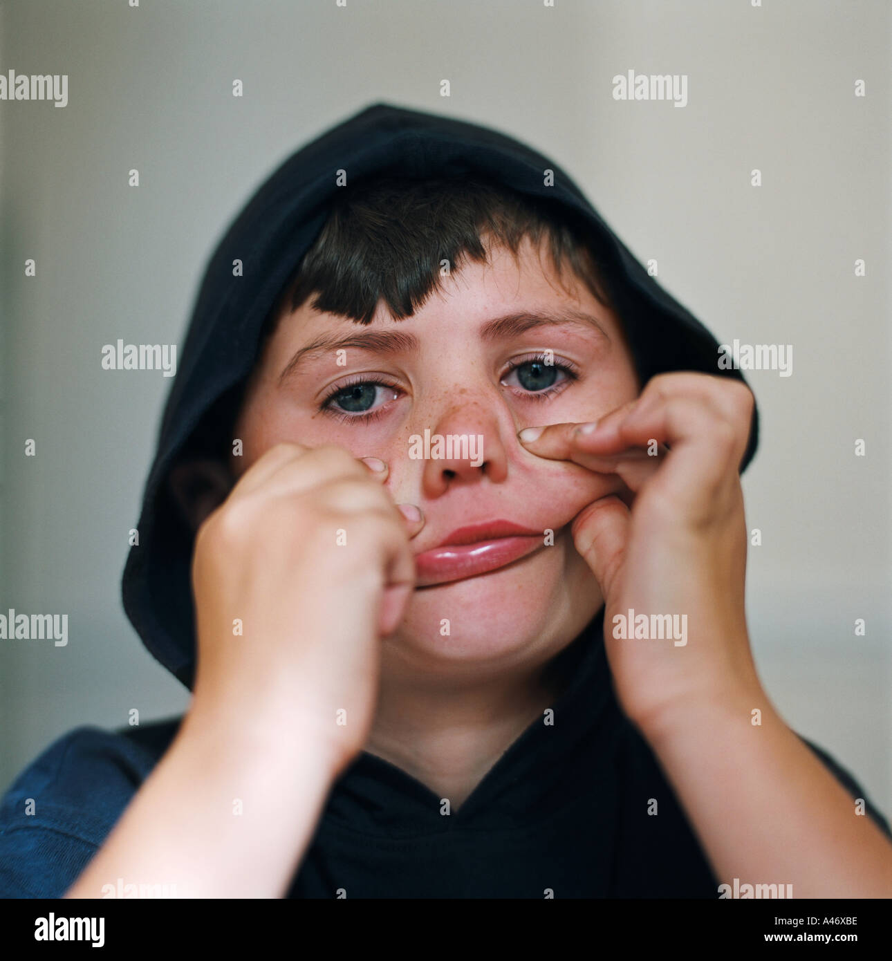 Boy making faces Stock Photo - Alamy