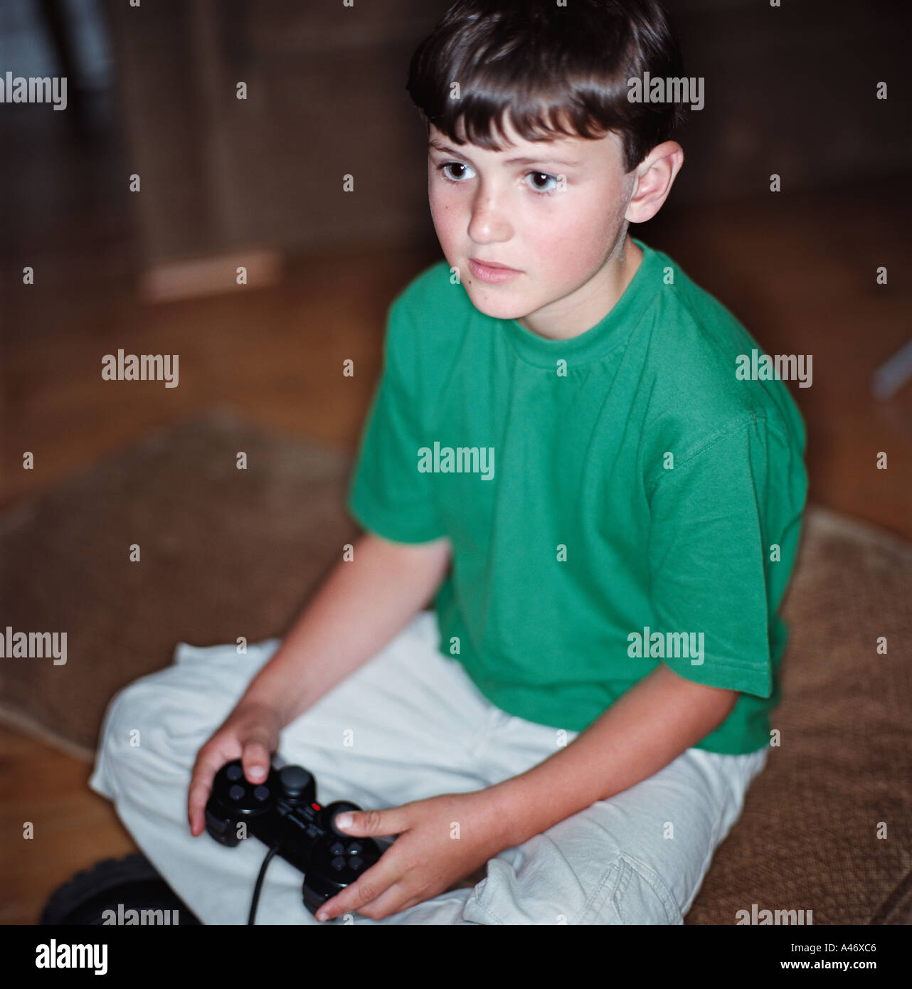 Boy playing a video game Stock Photo - Alamy