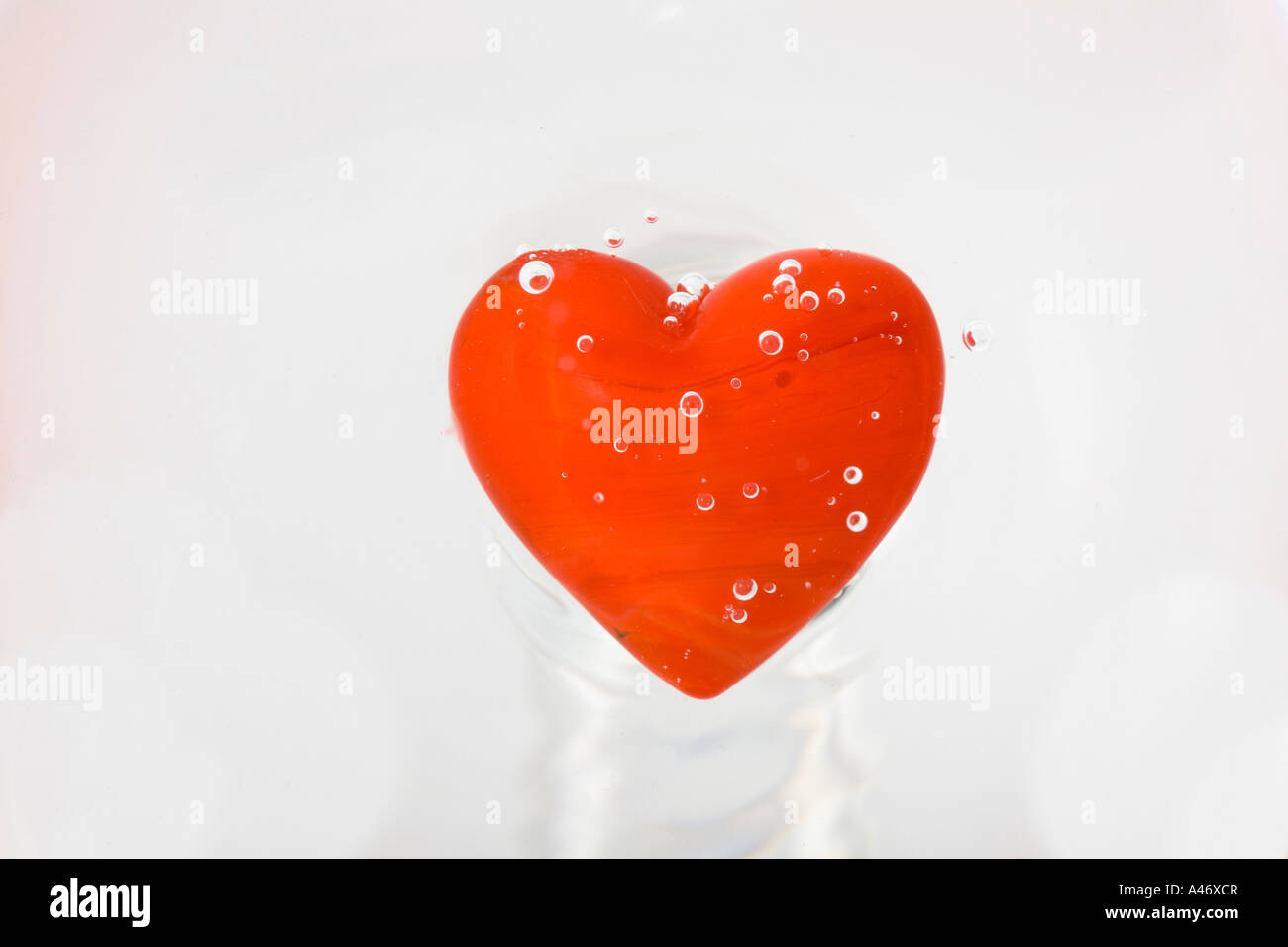 Red heart under water Stock Photo - Alamy