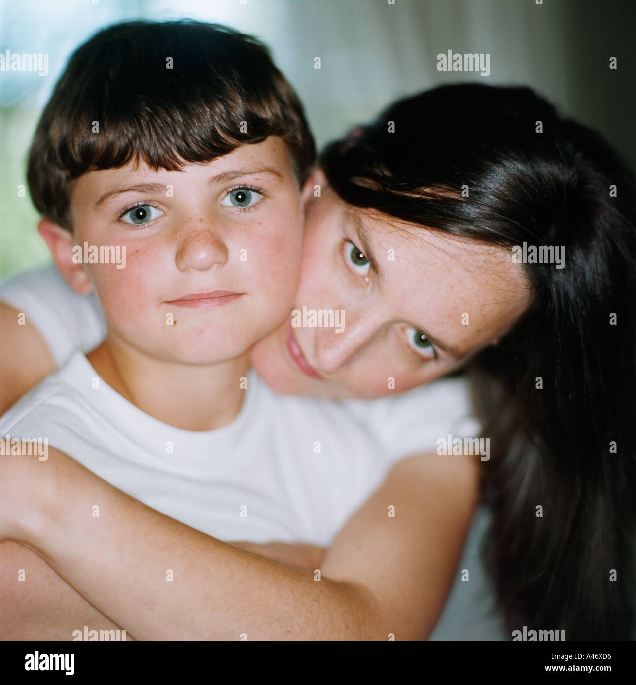Mother hugging her son Stock Photo - Alamy