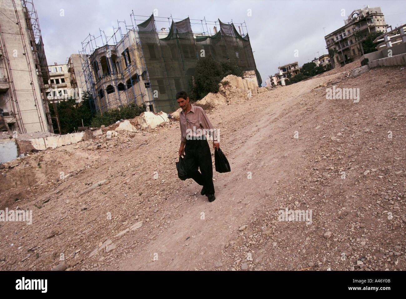 man walks through downtown beirut with his shopping beirut lebanon ...