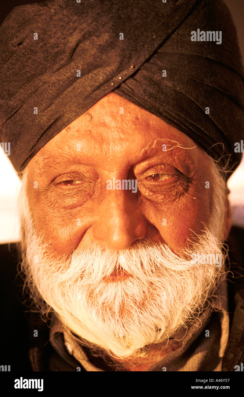A portrait of an elderly Sikh pilgrim at the golden temple in Amritsar ...