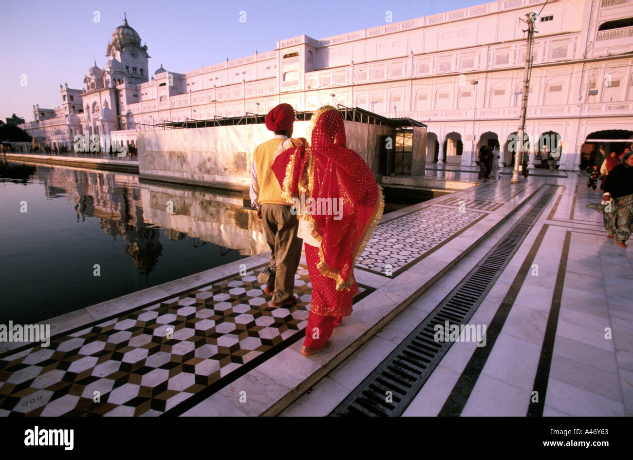 Two pilgrims, a husband and wife pilgrims at the Golden Temple in ...