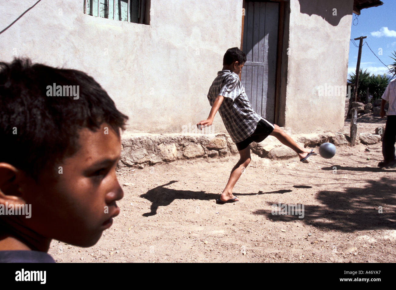 boys playing football in a shanty town above tegucigalpa honduras Stock ... boys playing football in a shanty town above tegucigalpa honduras Stock ...
