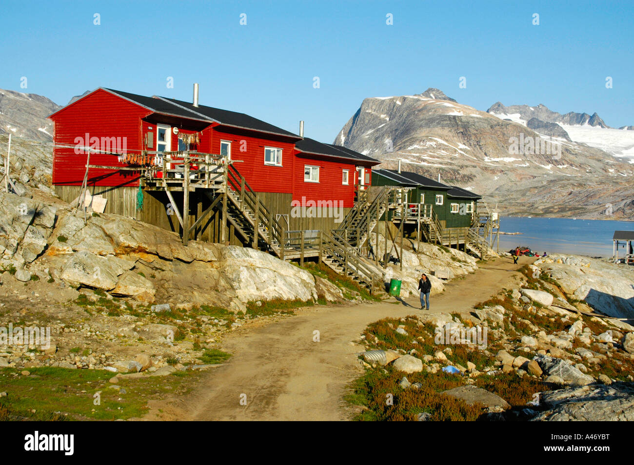 Colourful houses made of wood built on solid rock fjord mountain and ...