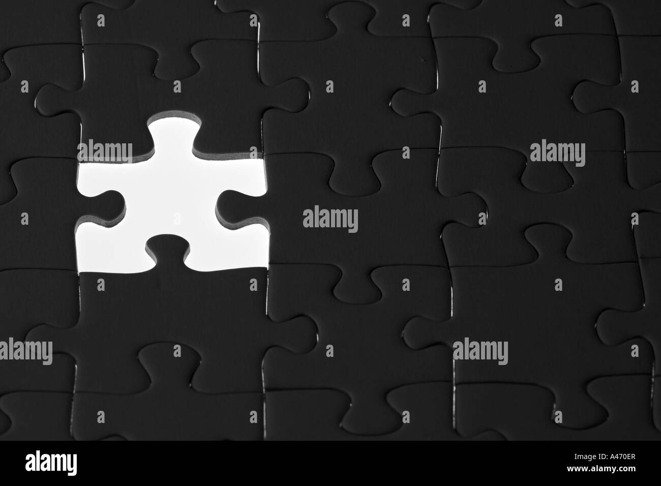 Jigsaw puzzle missing one piece Black and White Stock Photos & Images ...