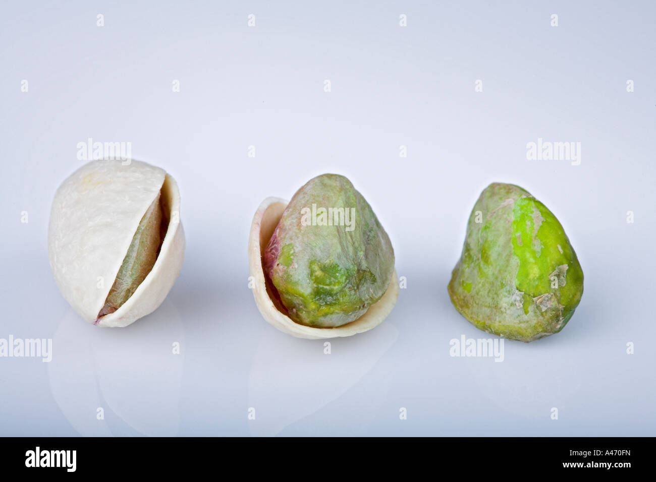 Pistachios, with shell, partly opened, without shell Stock Photo - Alamy