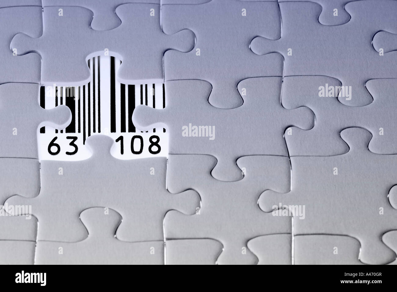 Jigsaw puzzle, the last missing piece revealing a barcode with numbers ...