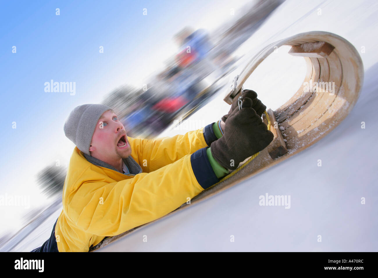 Man on a sled Stock Photo - Alamy