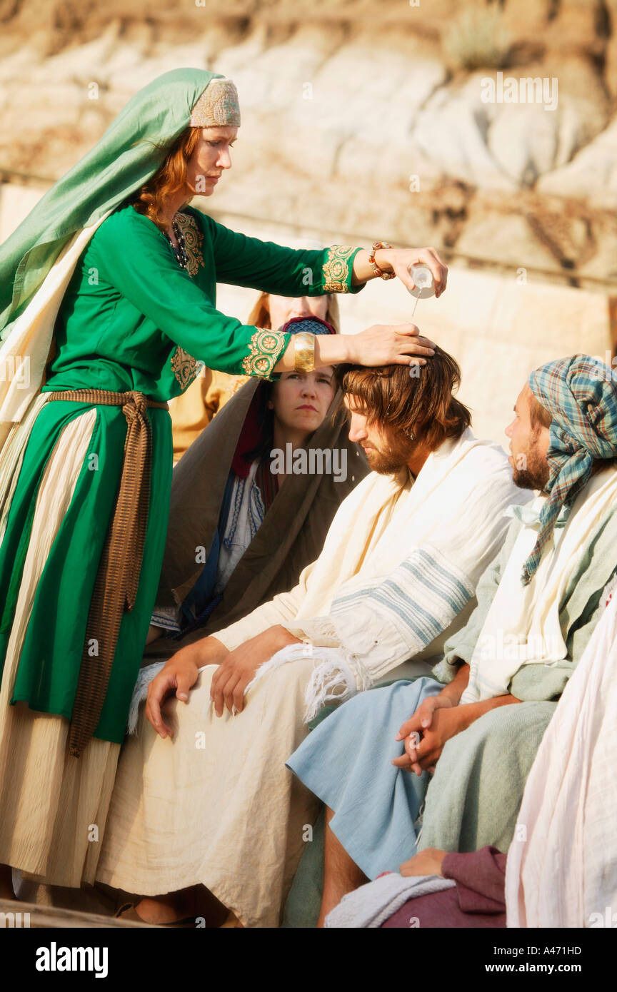 Woman pours oil on Jesus head Stock Photo - Alamy