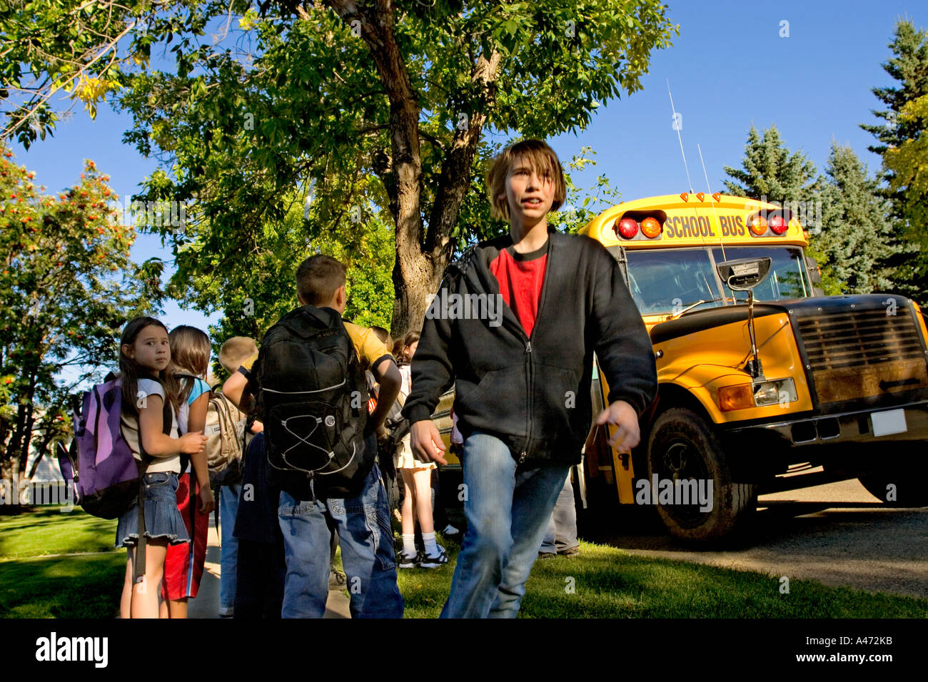 Children and school bus Stock Photo - Alamy