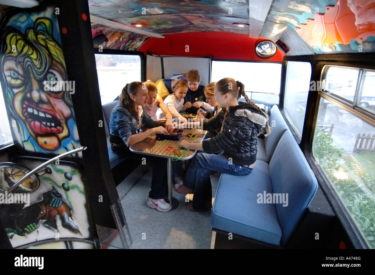 Traveller girls on the double decker community bus used as a classroom ...