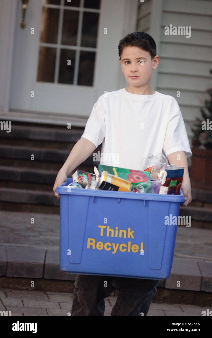 Young boy recycling Stock Photo - Alamy