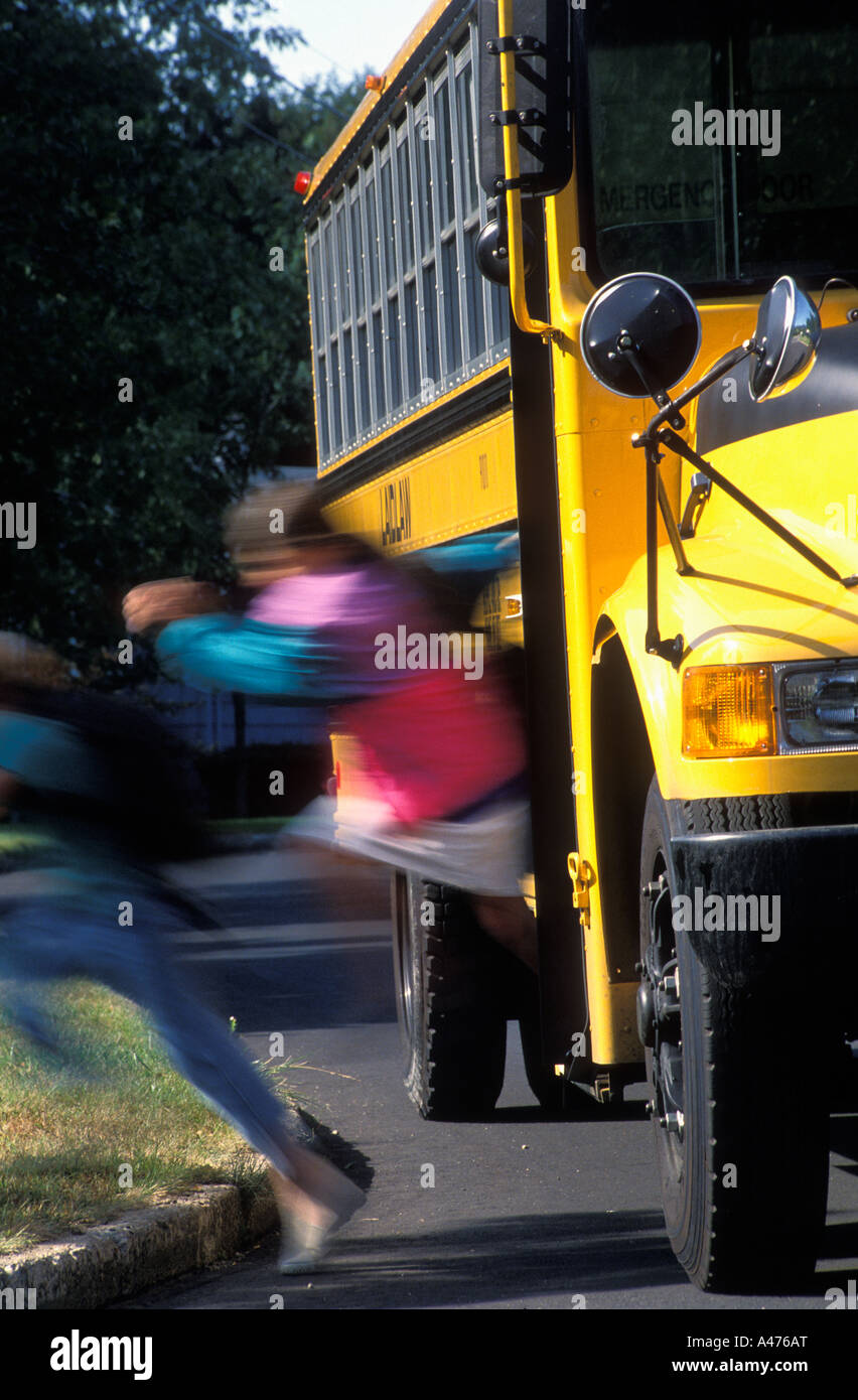 blurred image of students exiting a school bus Stock Photo - Alamy