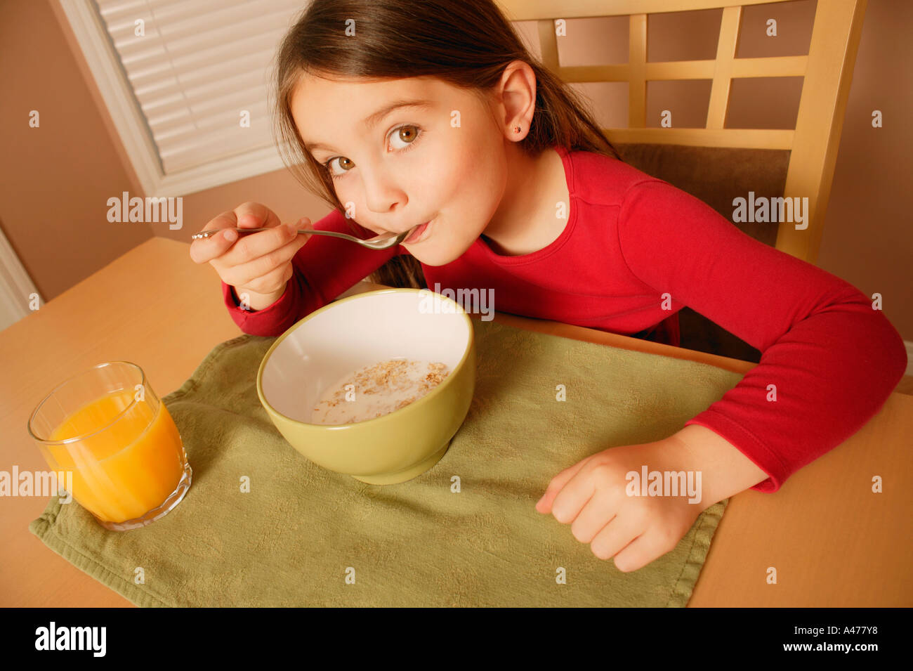 Child eating breakfast Stock Photo - Alamy